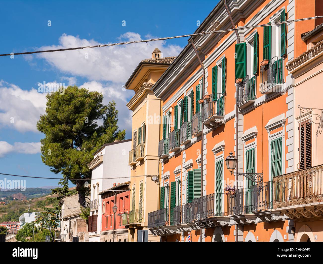 Facade of the colorful block with balconies in a typical Abruzzo town ...
