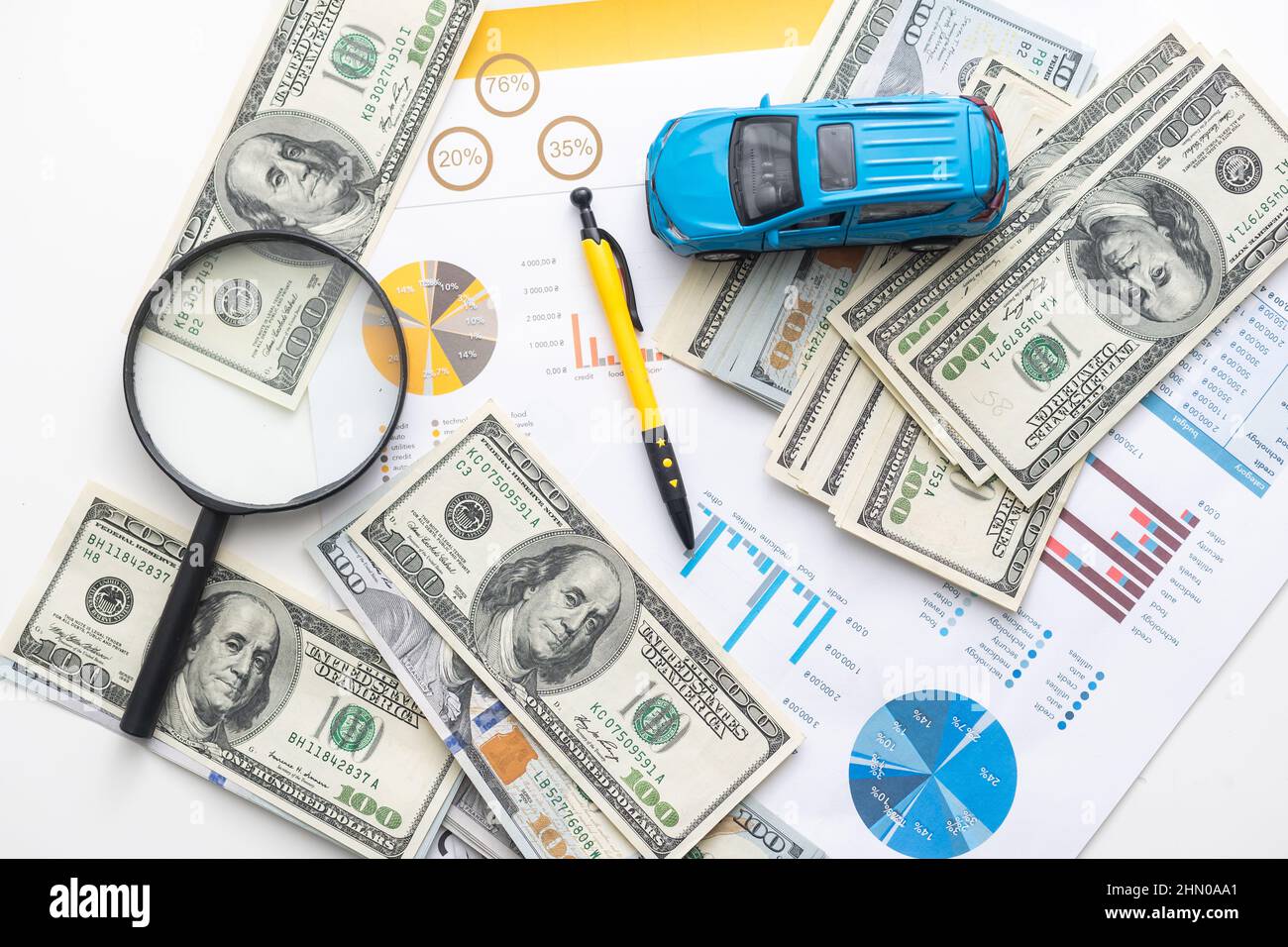 Car insurance concept. car model drive on money with insurance paper ...