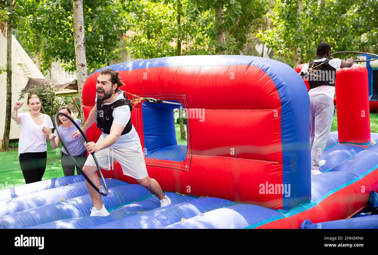 Attraction serso - who quickly put a hoop on a stick Stock Photo - Alamy