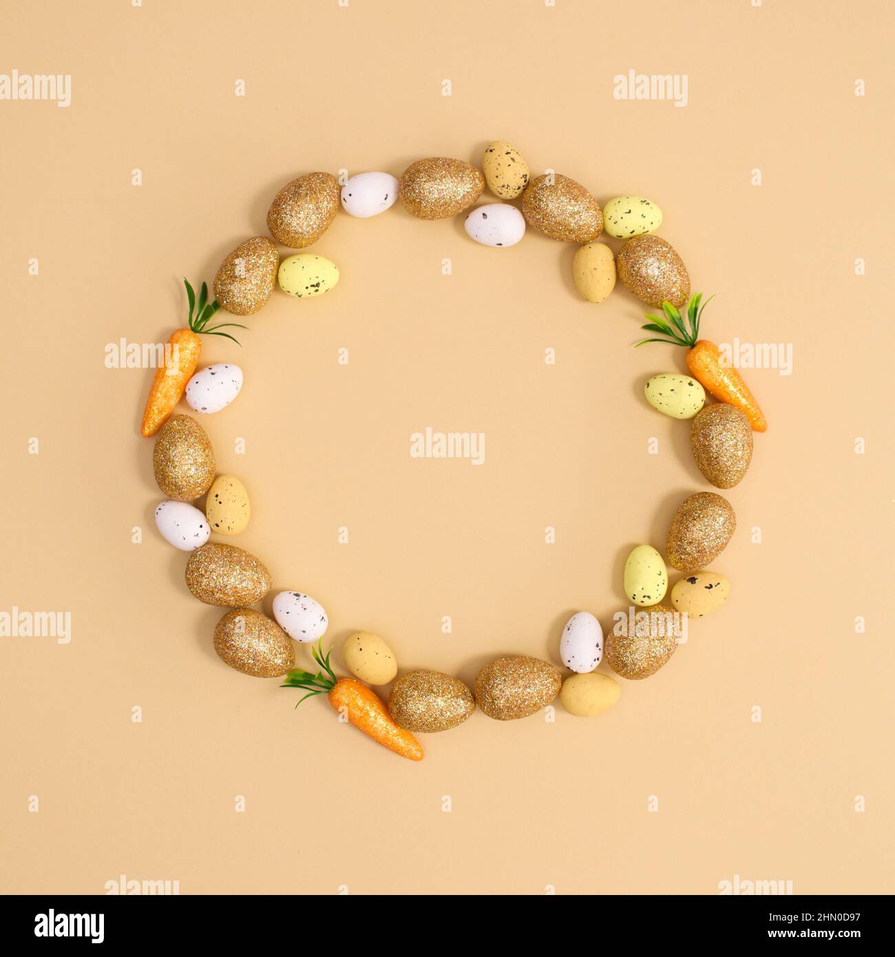Creative copy space circle frame for Easter with eggs and carrots on ...