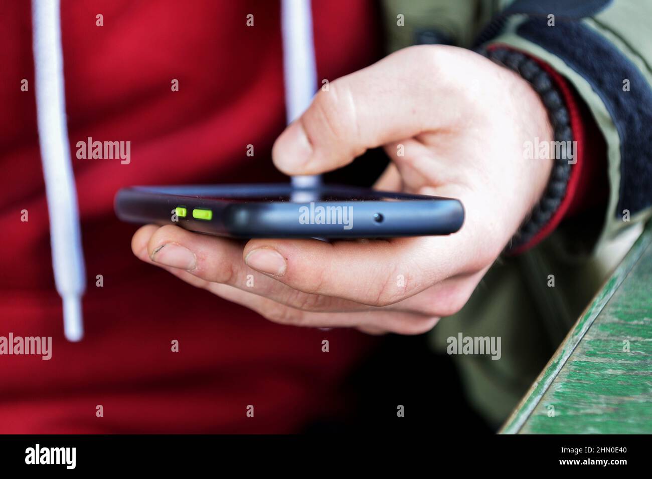 Close up of a man using mobile smart phone outdoor Stock Photo - Alamy