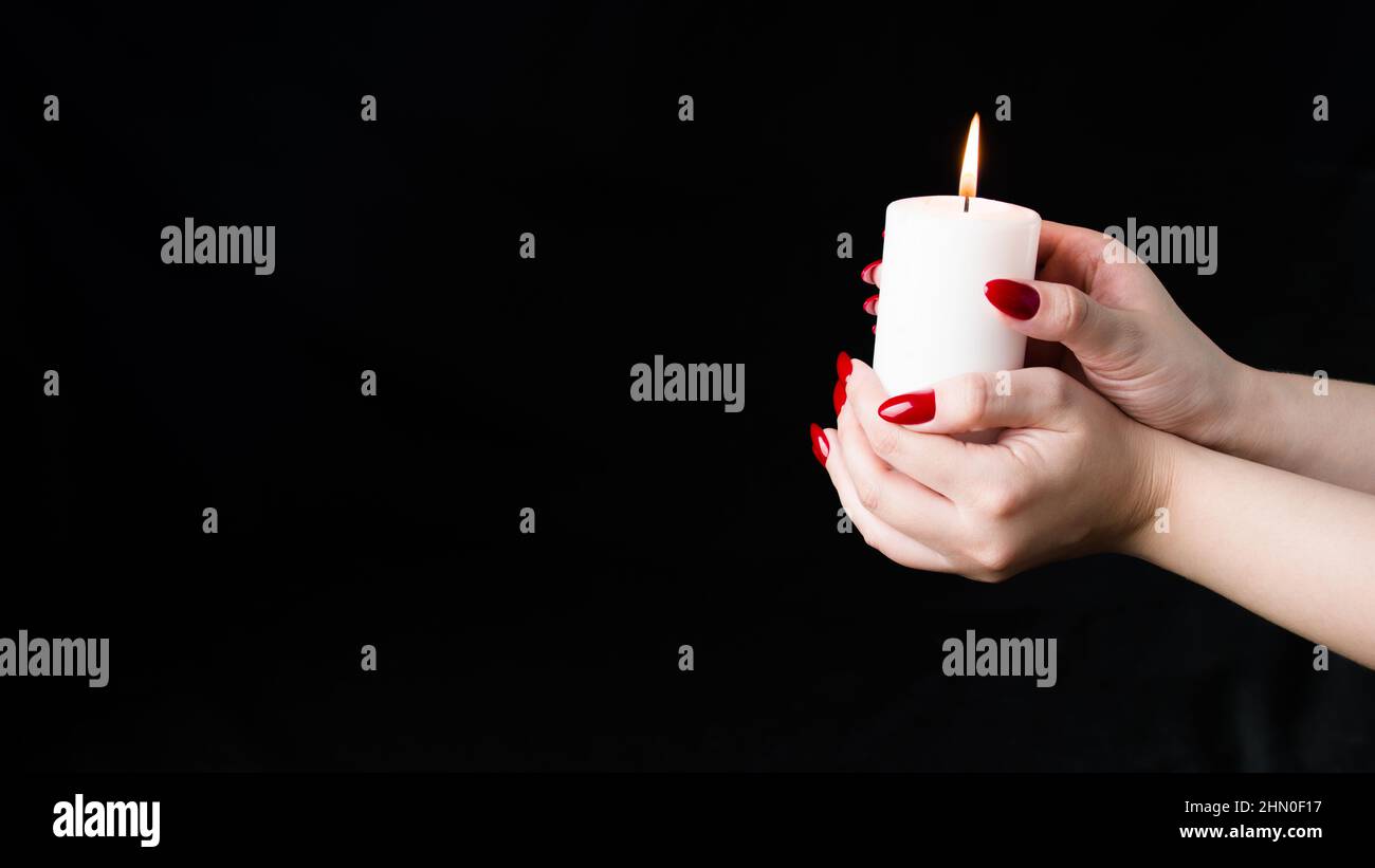 Crop person with burning candle. Crop anonymous person demonstrating ...
