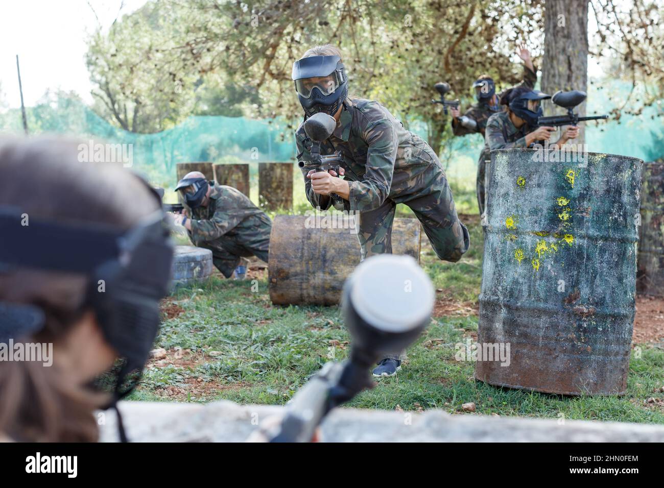 Female paintball player aiming in shootout Stock Photo - Alamy