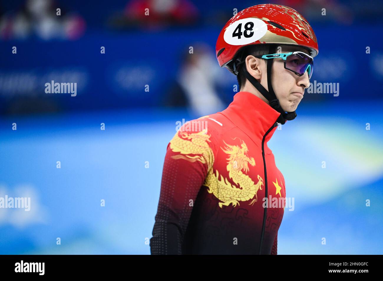 Beijing, China. 13th Feb, 2022. Wu Dajing of China reacts after the men ...
