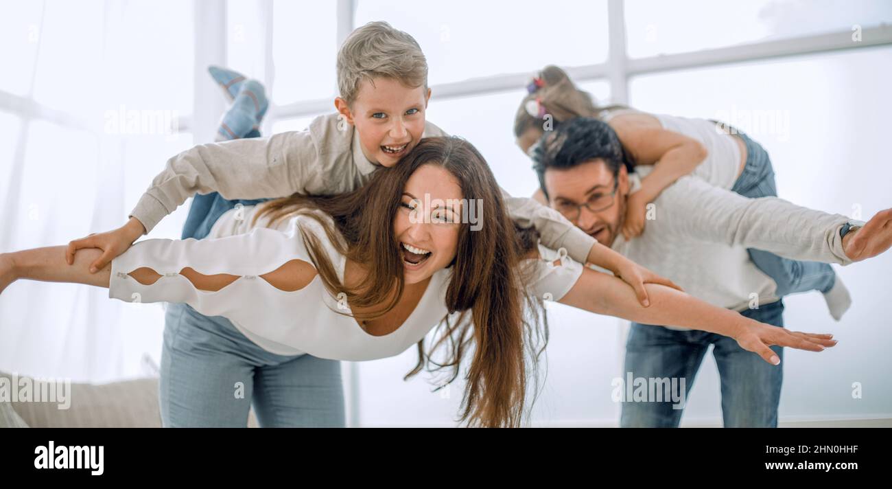 parents have fun with their children on a free evening Stock Photo - Alamy