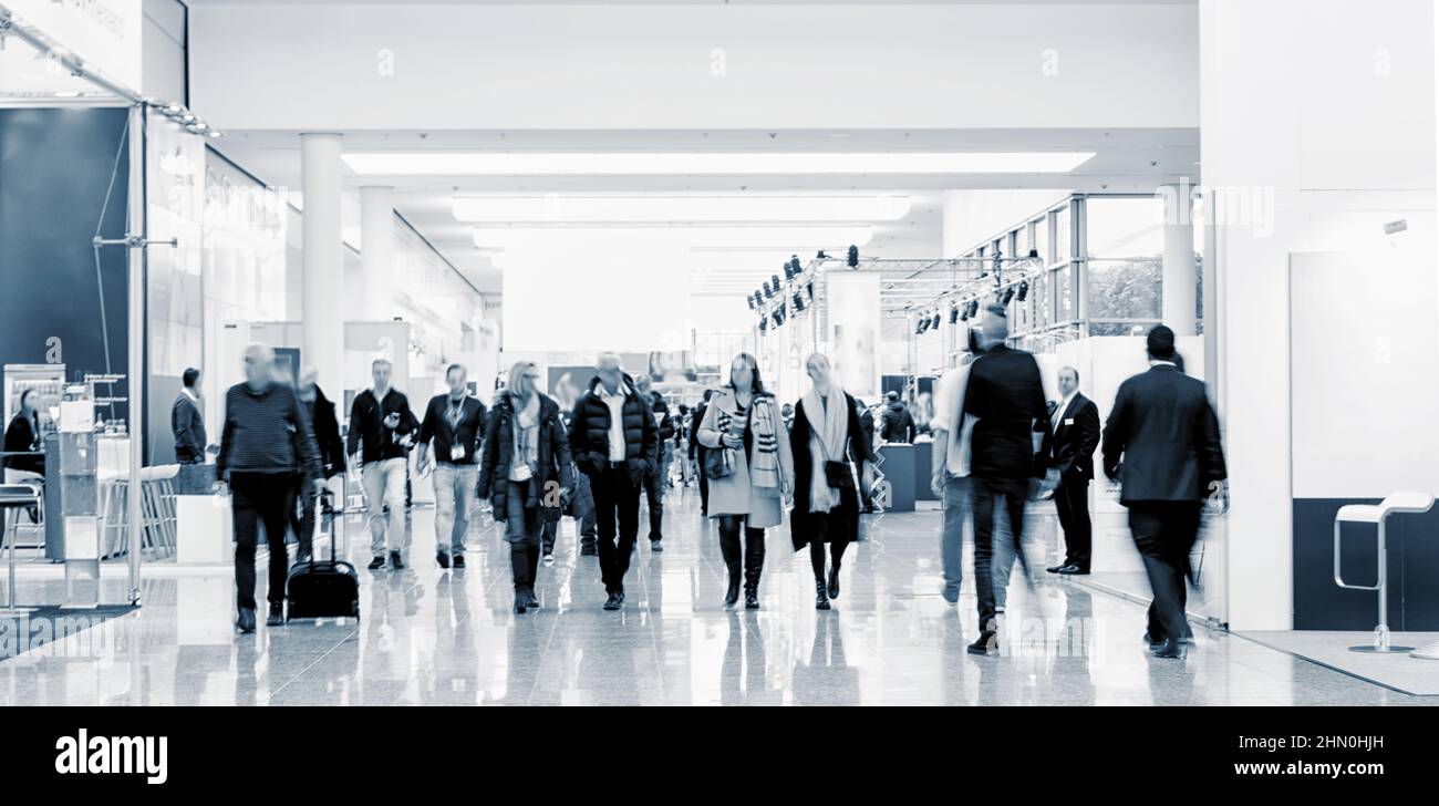 crowd of Blurred business people at a trade fair floor Stock Photo - Alamy