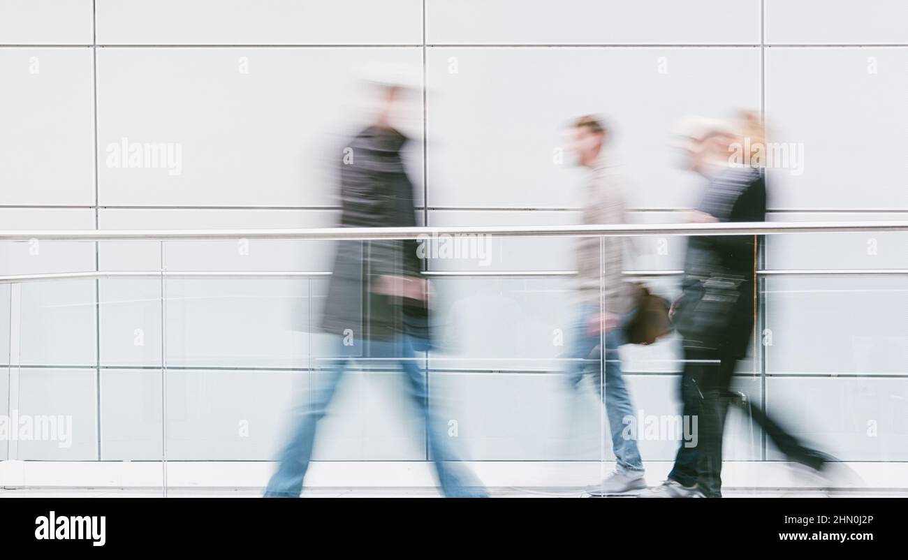 blurred people walking in a corridor at fait hall Stock Photo - Alamy