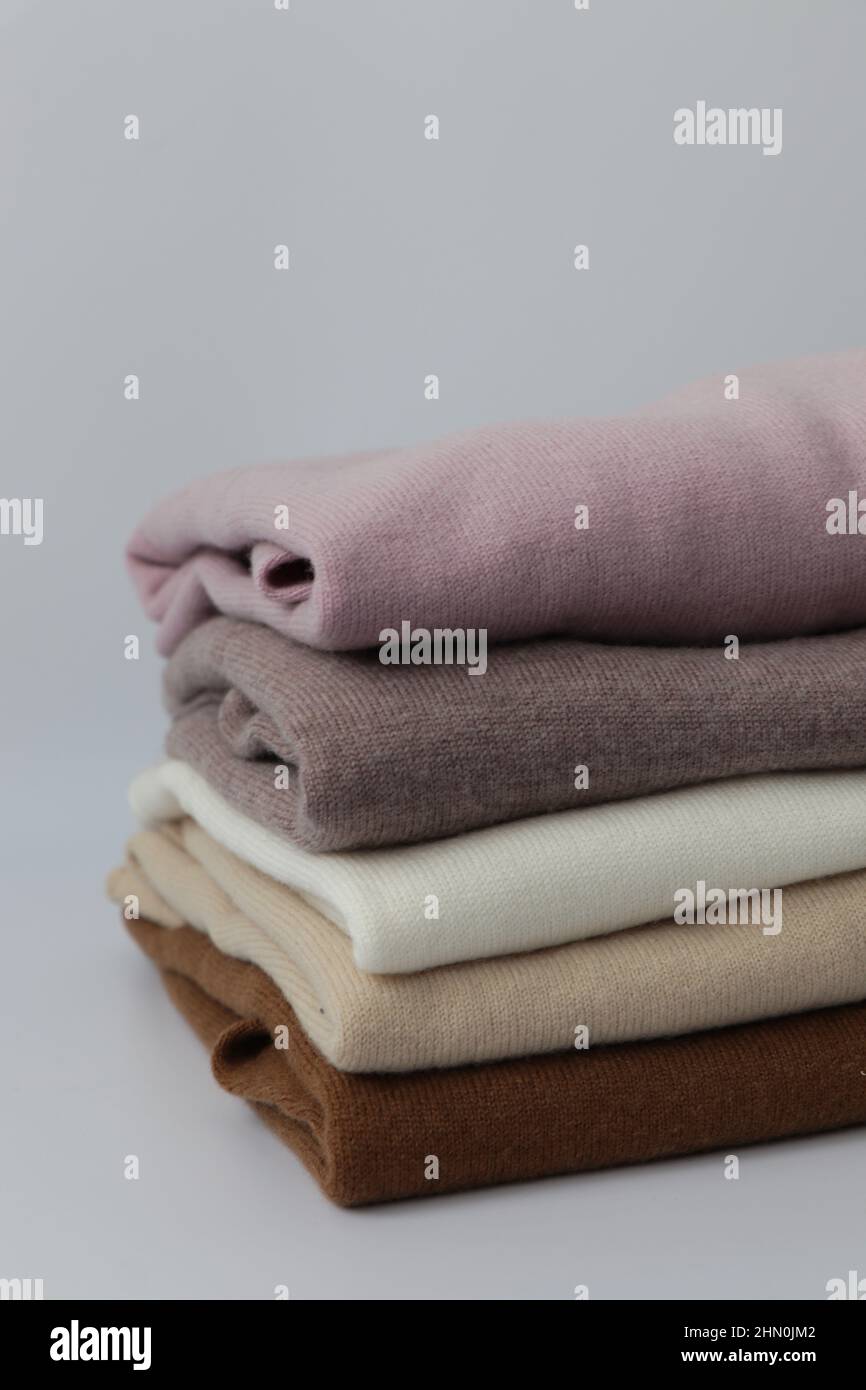 Pile or stack of colorful, folded cashmere or merino wool jumpers Stock ...