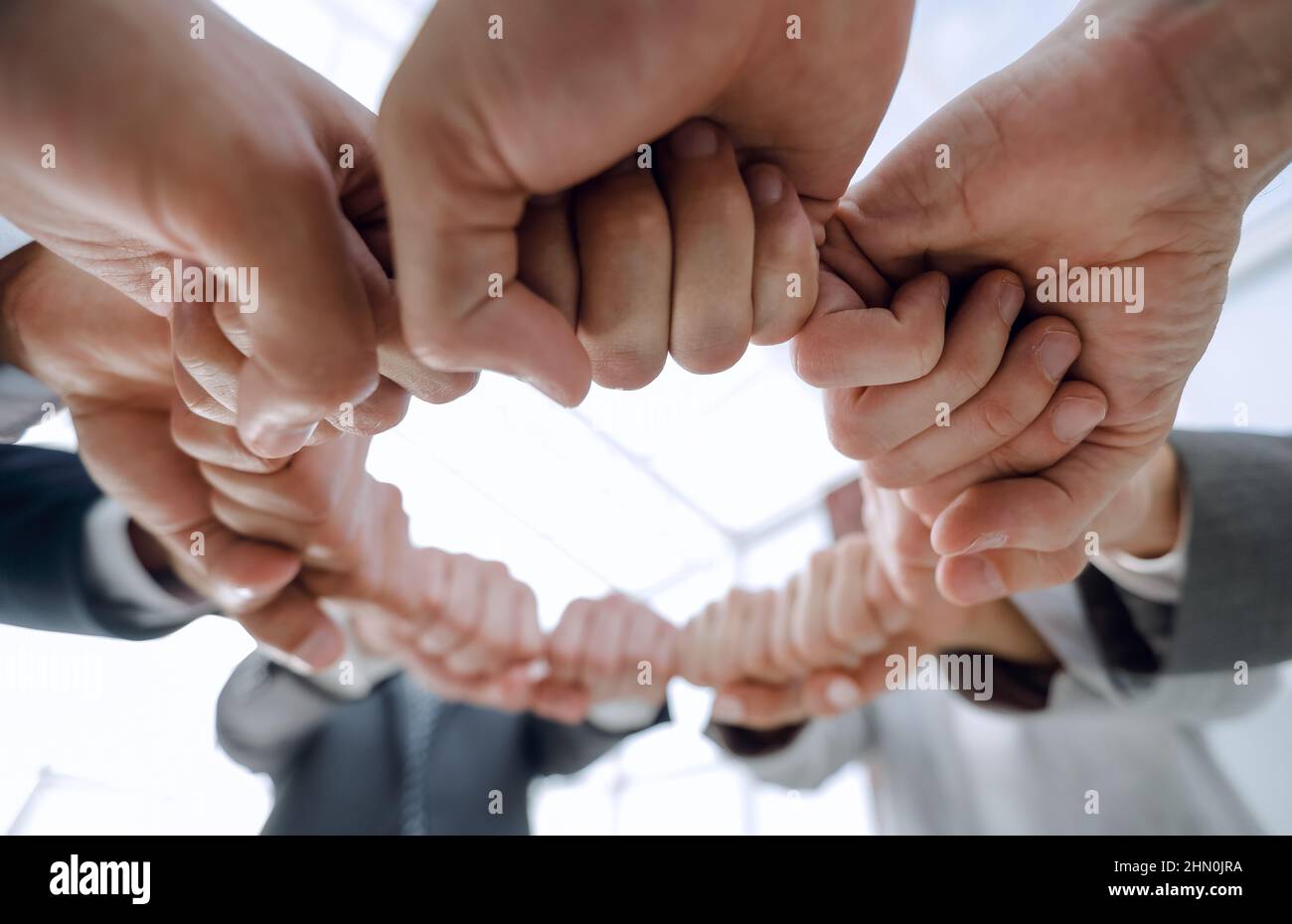 group of people joined their hands Stock Photo - Alamy