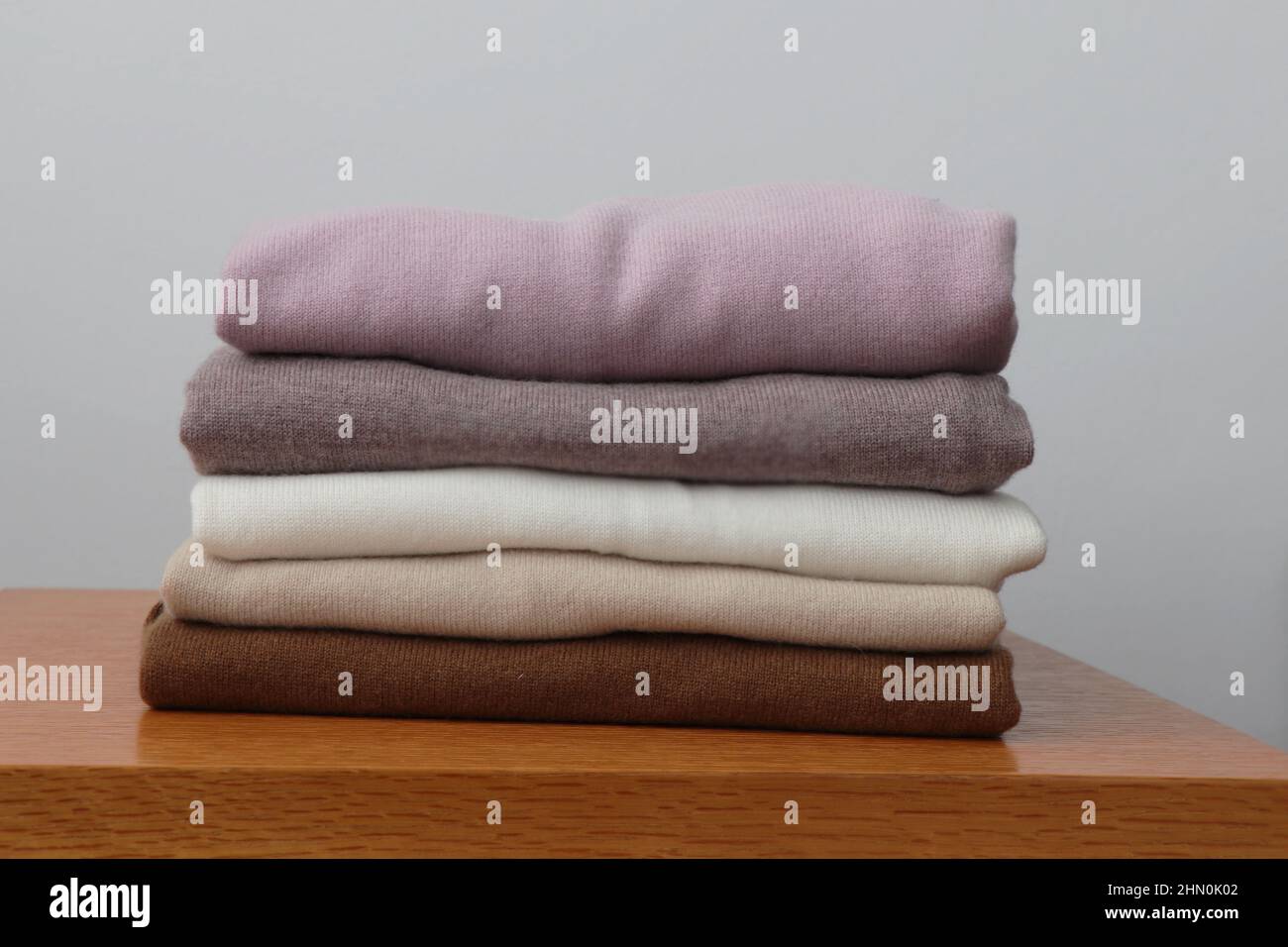 Pile or stack of colorful, folded cashmere or merino wool jumpers Stock ...