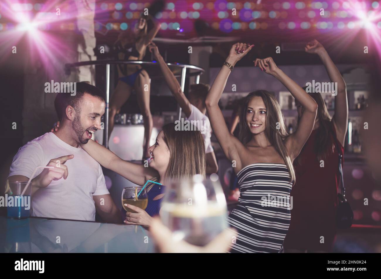 Group of people clubbing in the night club Stock Photo - Alamy