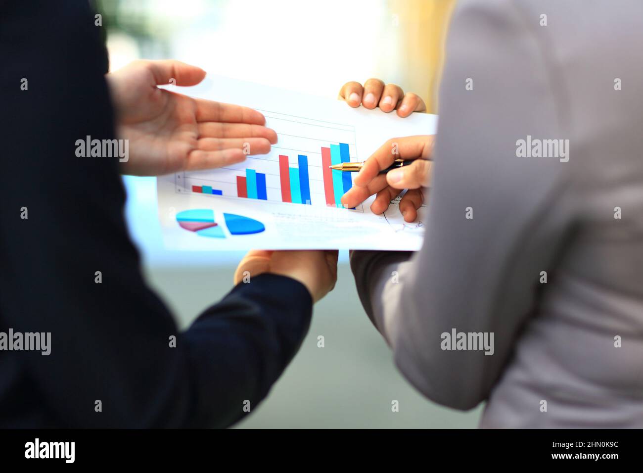 Close-up of graphs and charts analyzed by business people Stock Photo ...