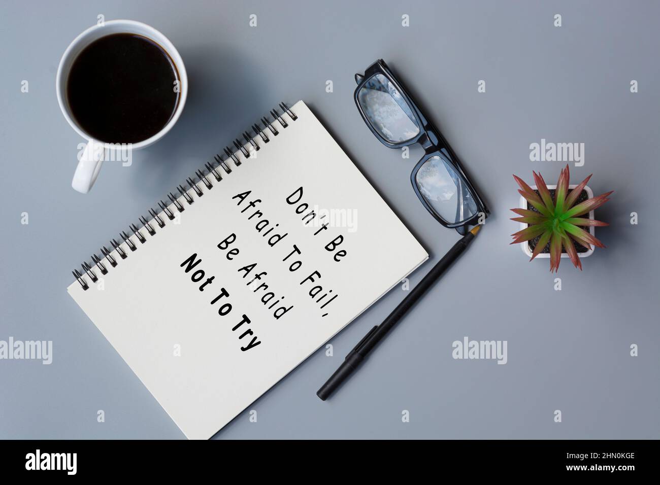 Motivational quote on notepad - Do not be afraid to fail, be afraid not ...