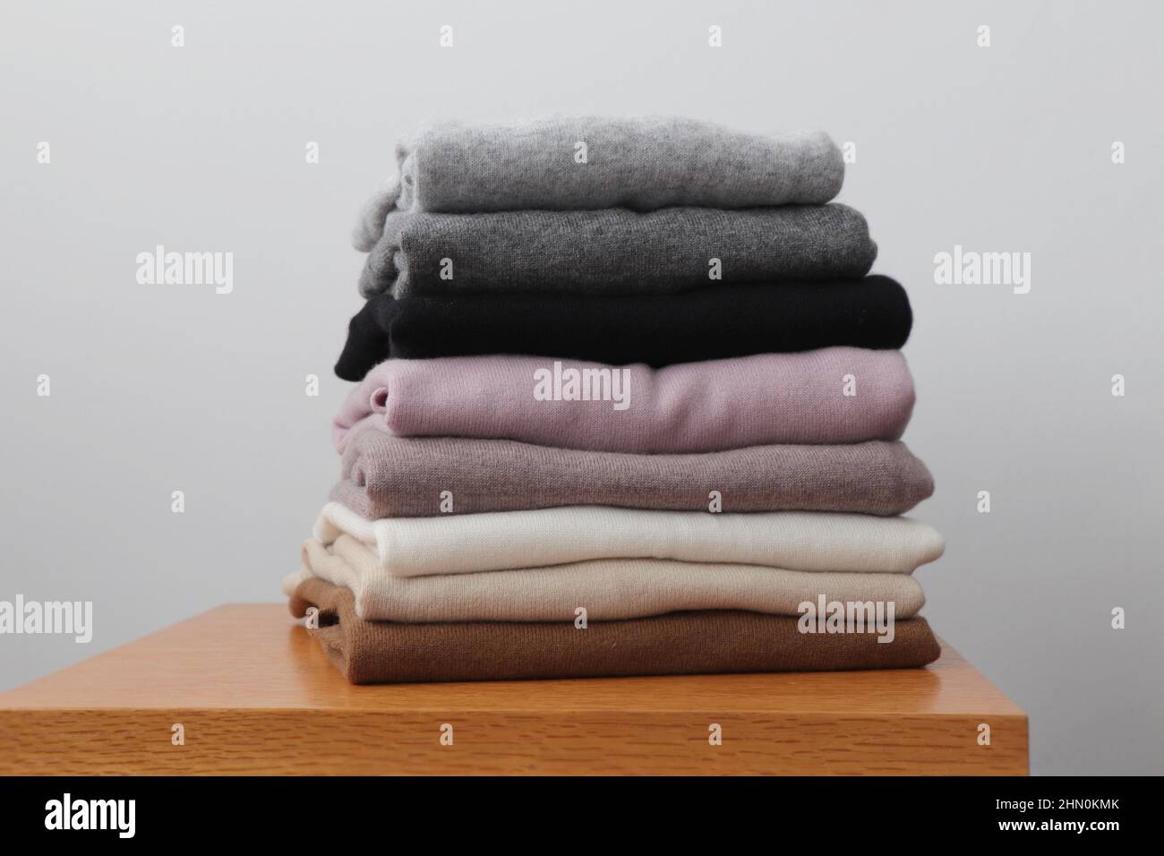 Pile or stack of colorful, folded cashmere or merino wool jumpers Stock ...