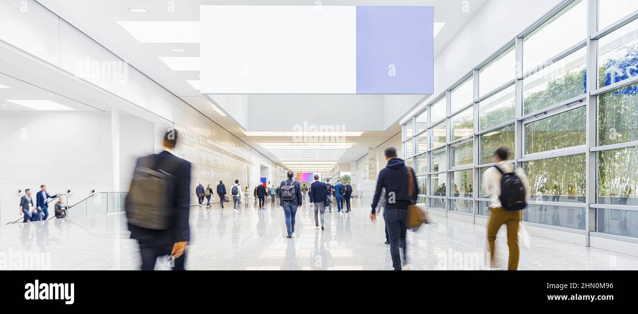 Blank advertising space at trade show or congress over many anonymous ...