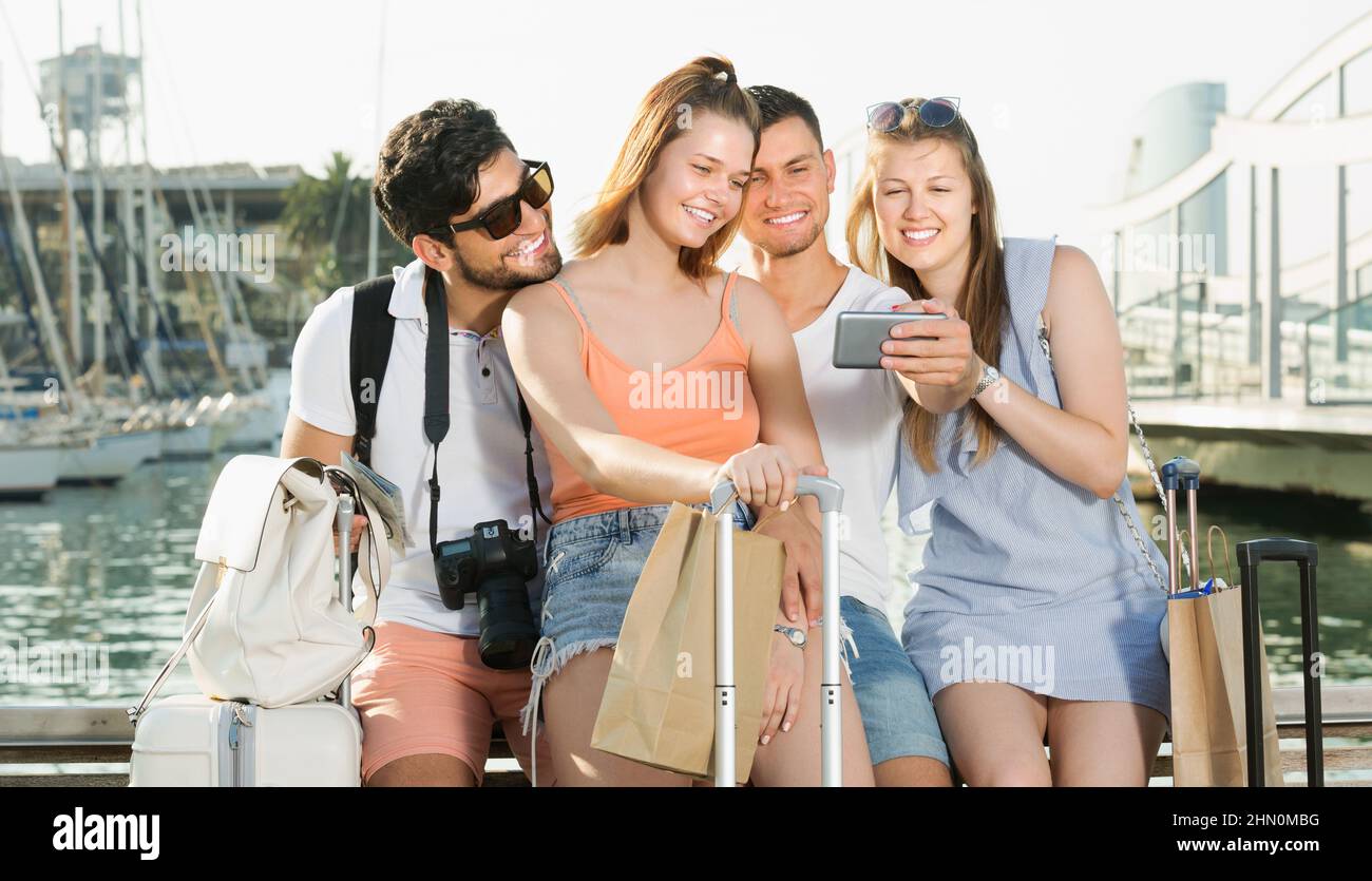 Group positive smiling tourists hi-res stock photography and images - Alamy
