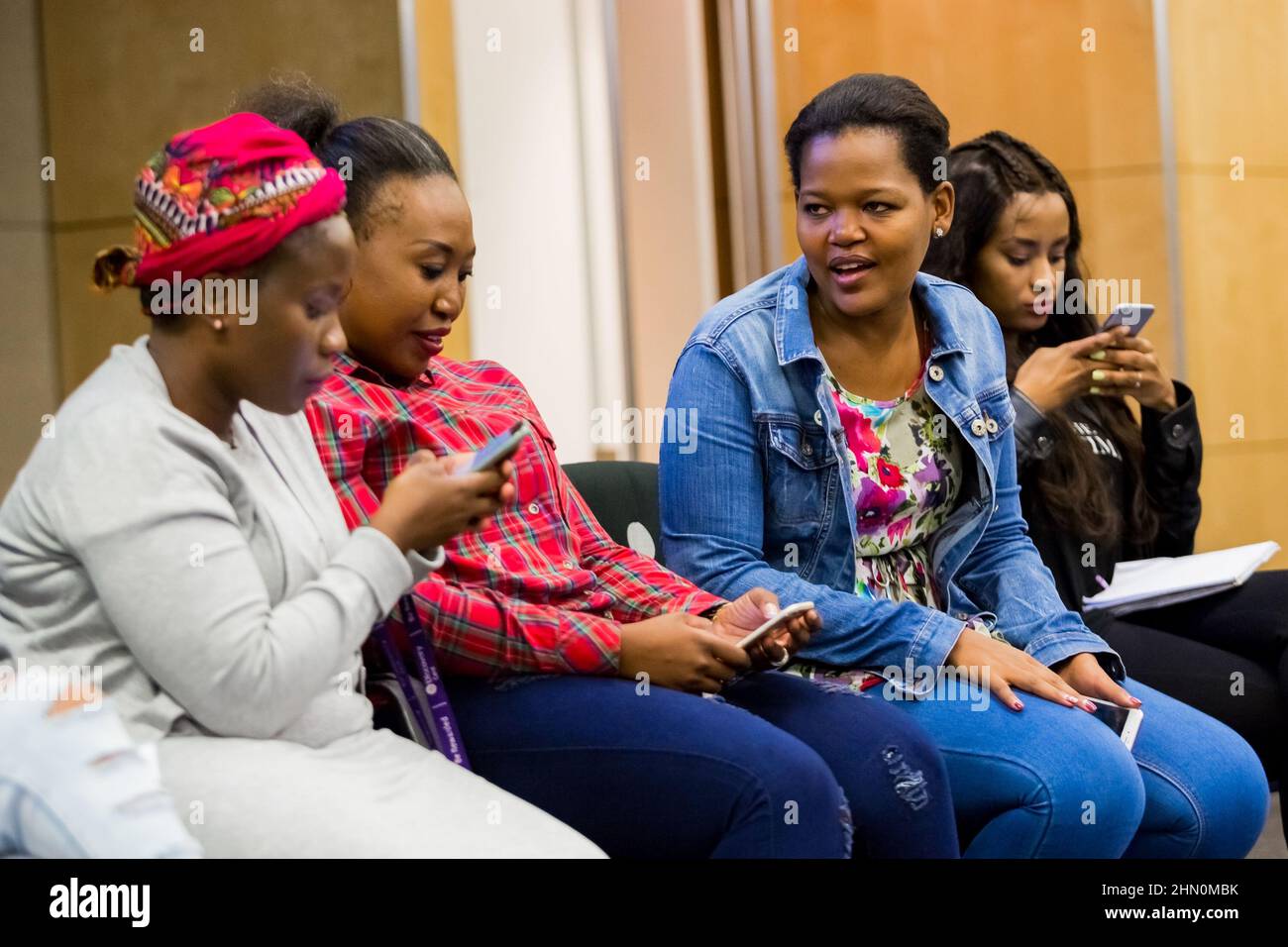 Diverse adult students attending a class on finance Stock Photo - Alamy