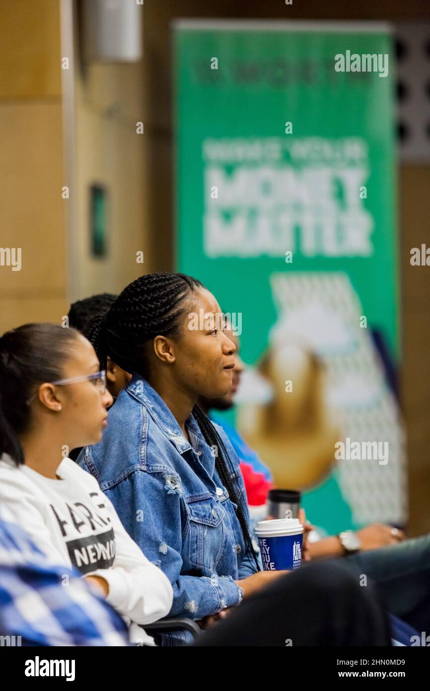 Vertical shot of some diverse adult students attending a class on ...