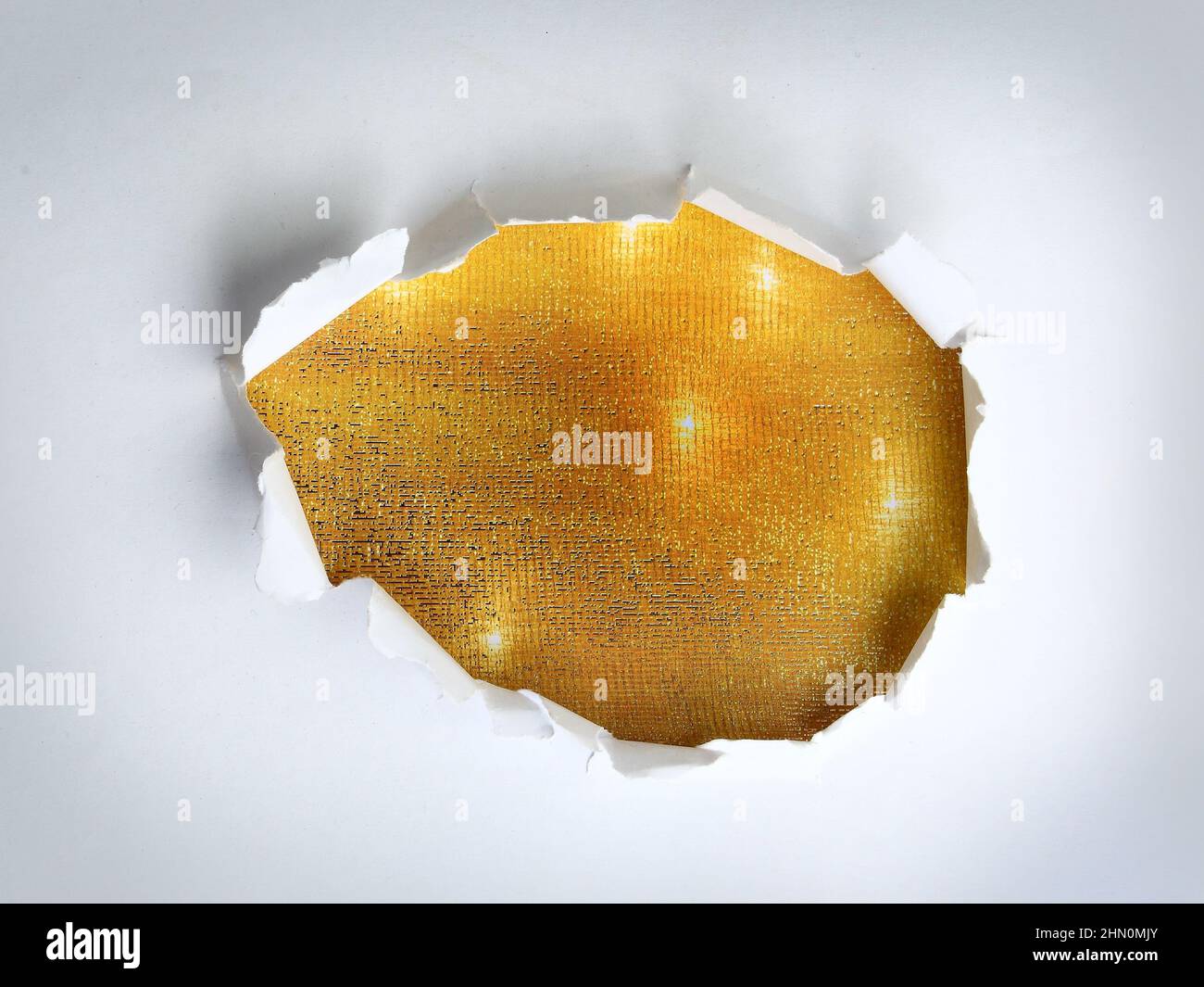 Hole in the paper Stock Photo - Alamy