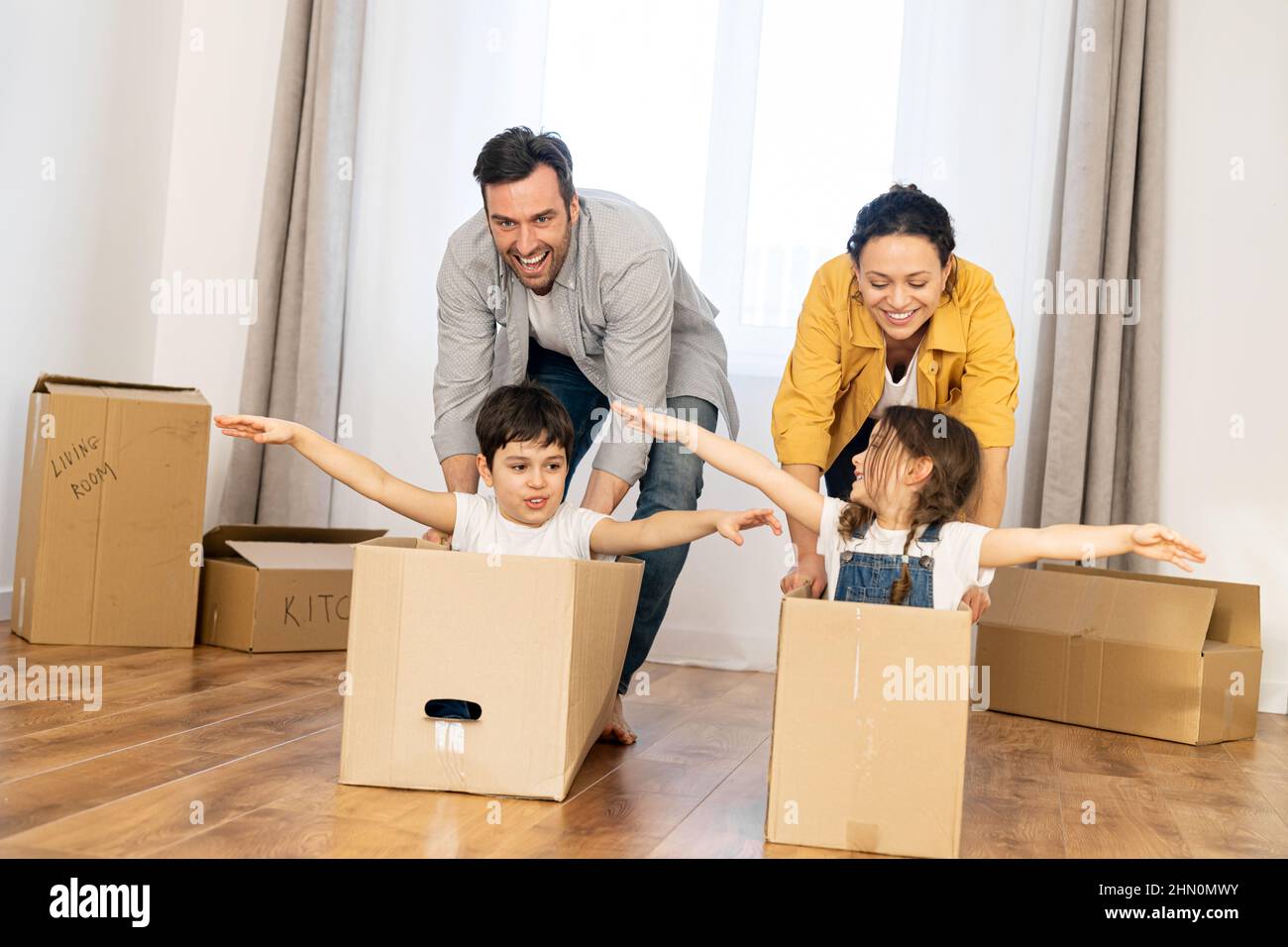 Kids pushing empty box hi-res stock photography and images - Alamy