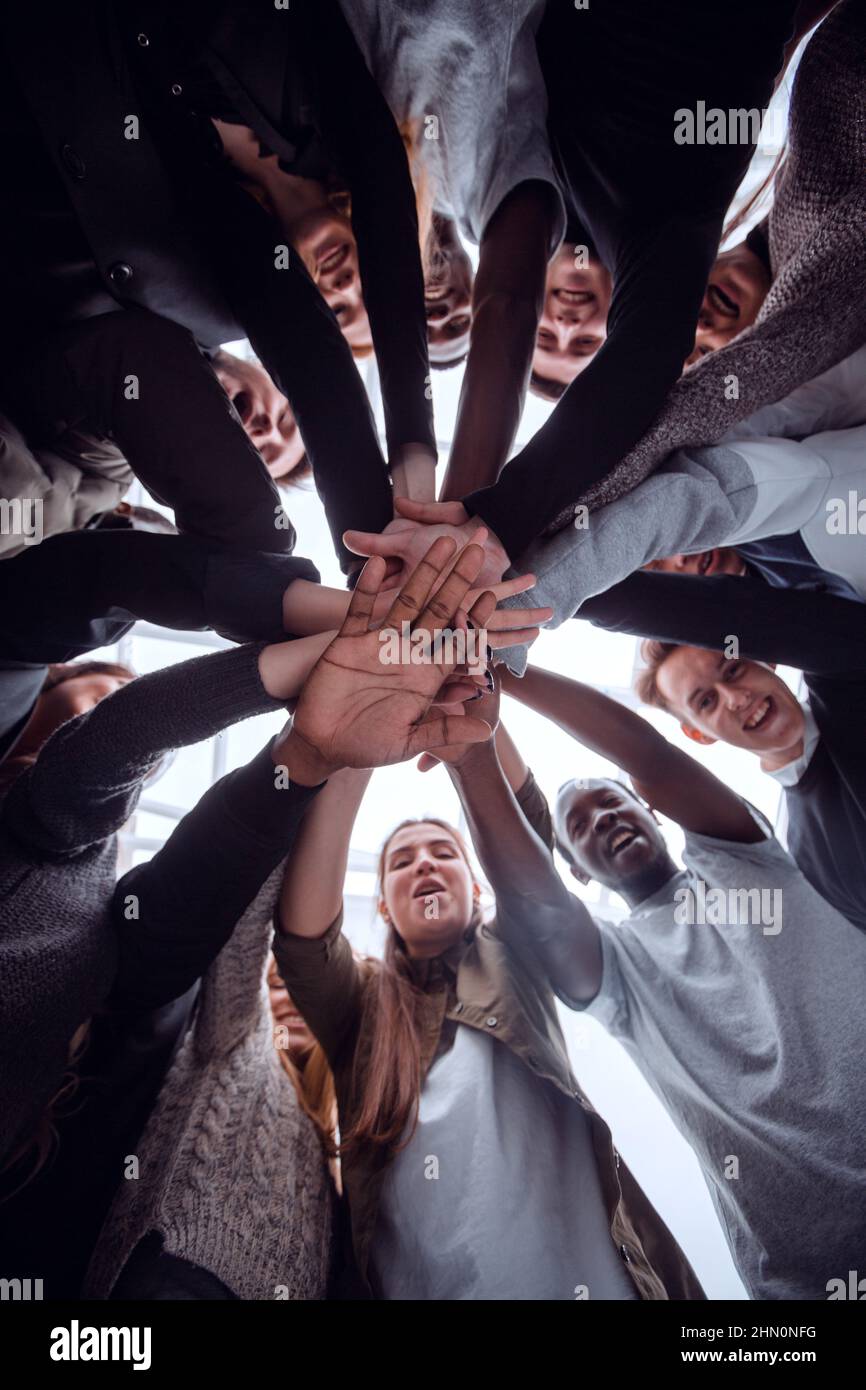 bottom view. group of happy young people making a stack of hands Stock ...