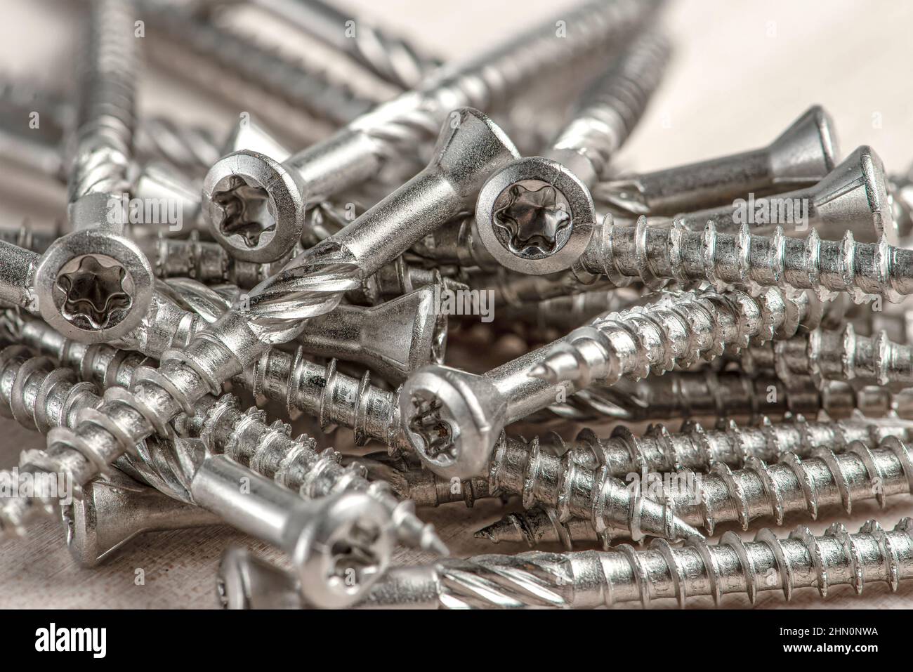 Close-up of universal silver screws with torx head. Self-tapping screws ...