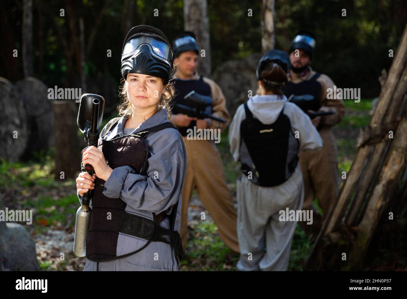 Portrait of young woman paintball player Stock Photo - Alamy