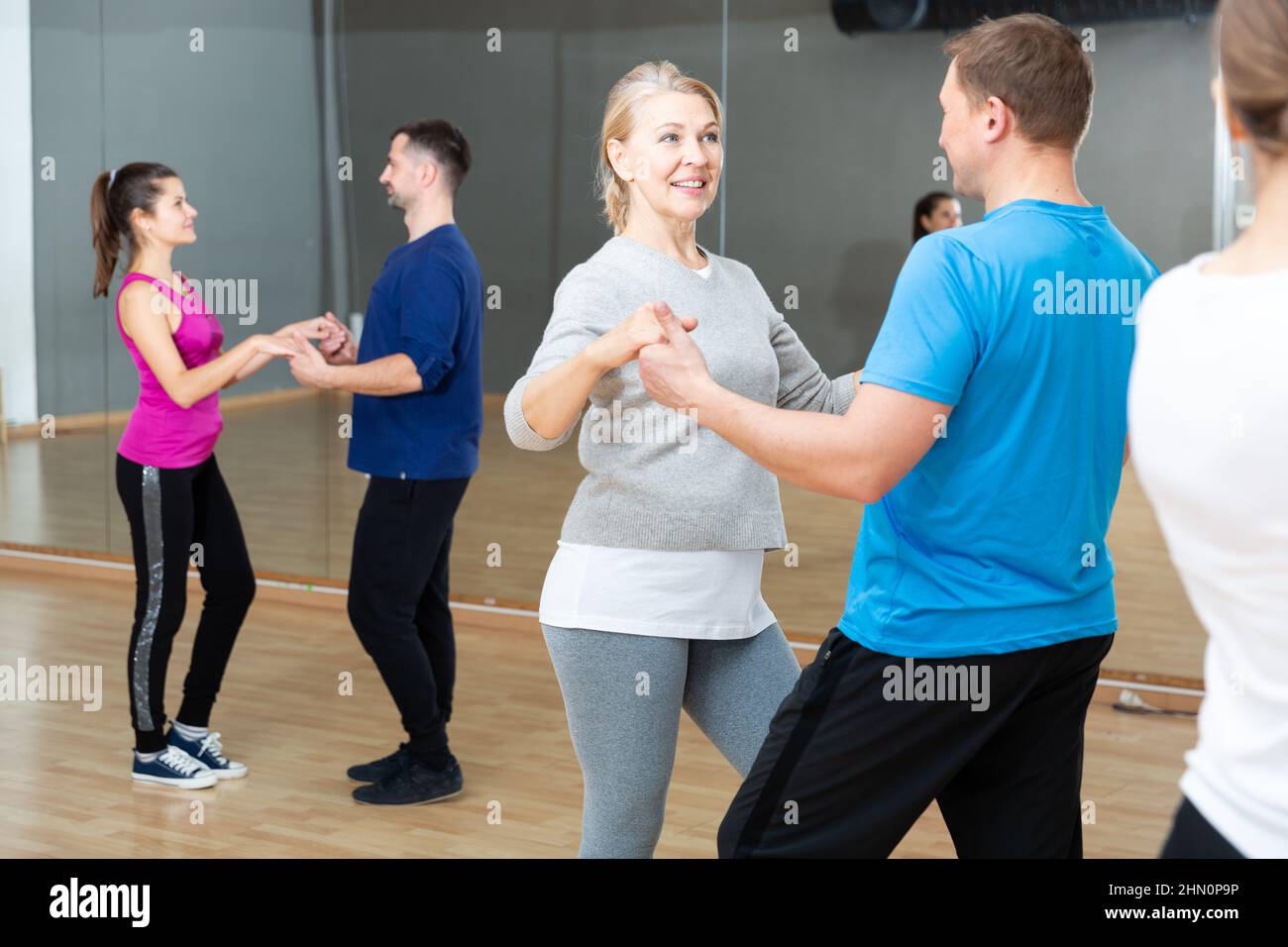 Mature dancing couple during group class Stock Photo - Alamy