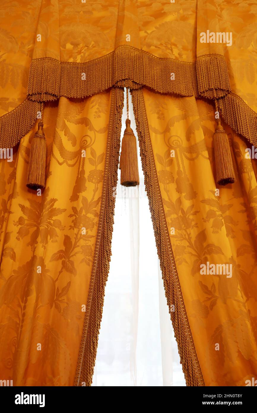 Details of window with brown curtain in palace Stock Photo - Alamy