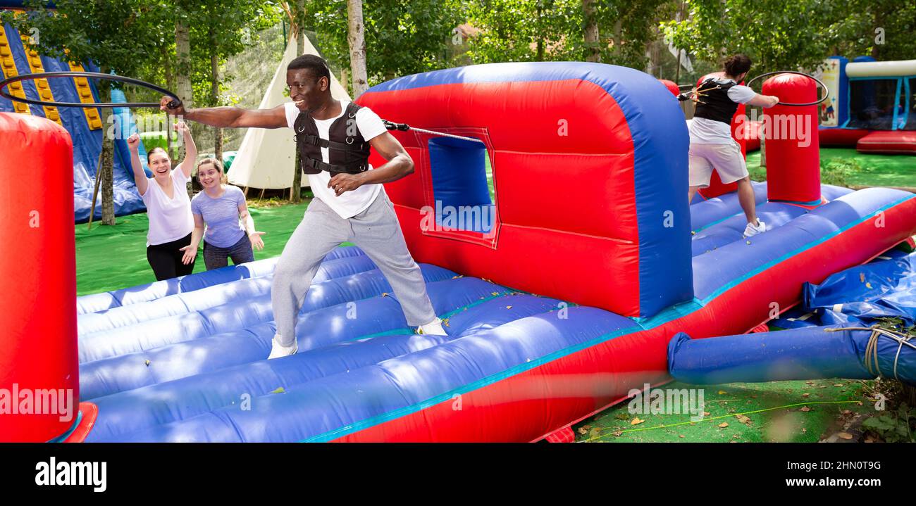 Competition of two men - who quickly throw a hoop on a stick Stock ...