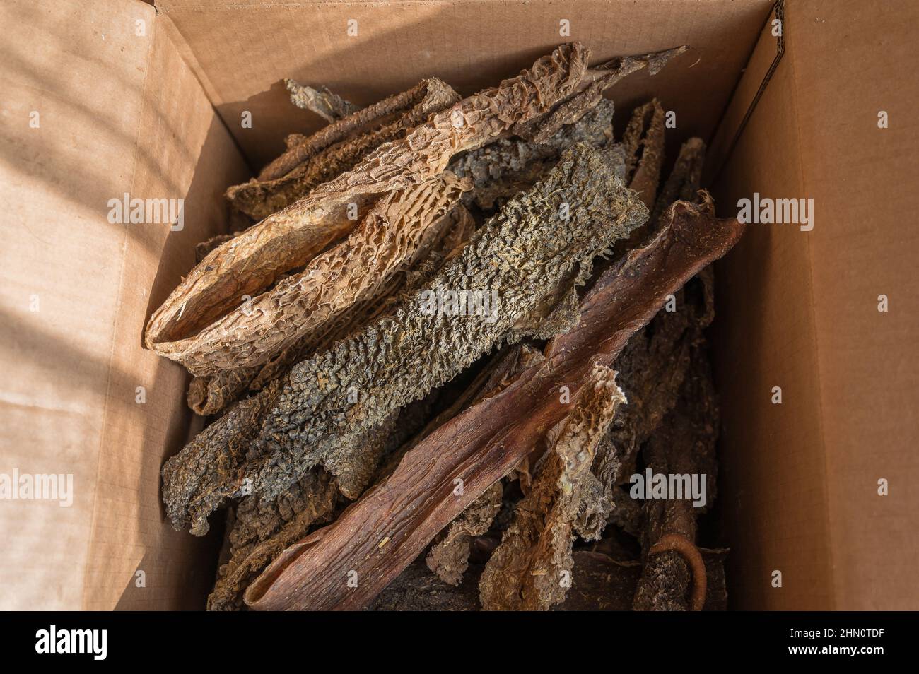 Dried beef offal. Dried tripe. A full cardboard box of chewy dog treats ...