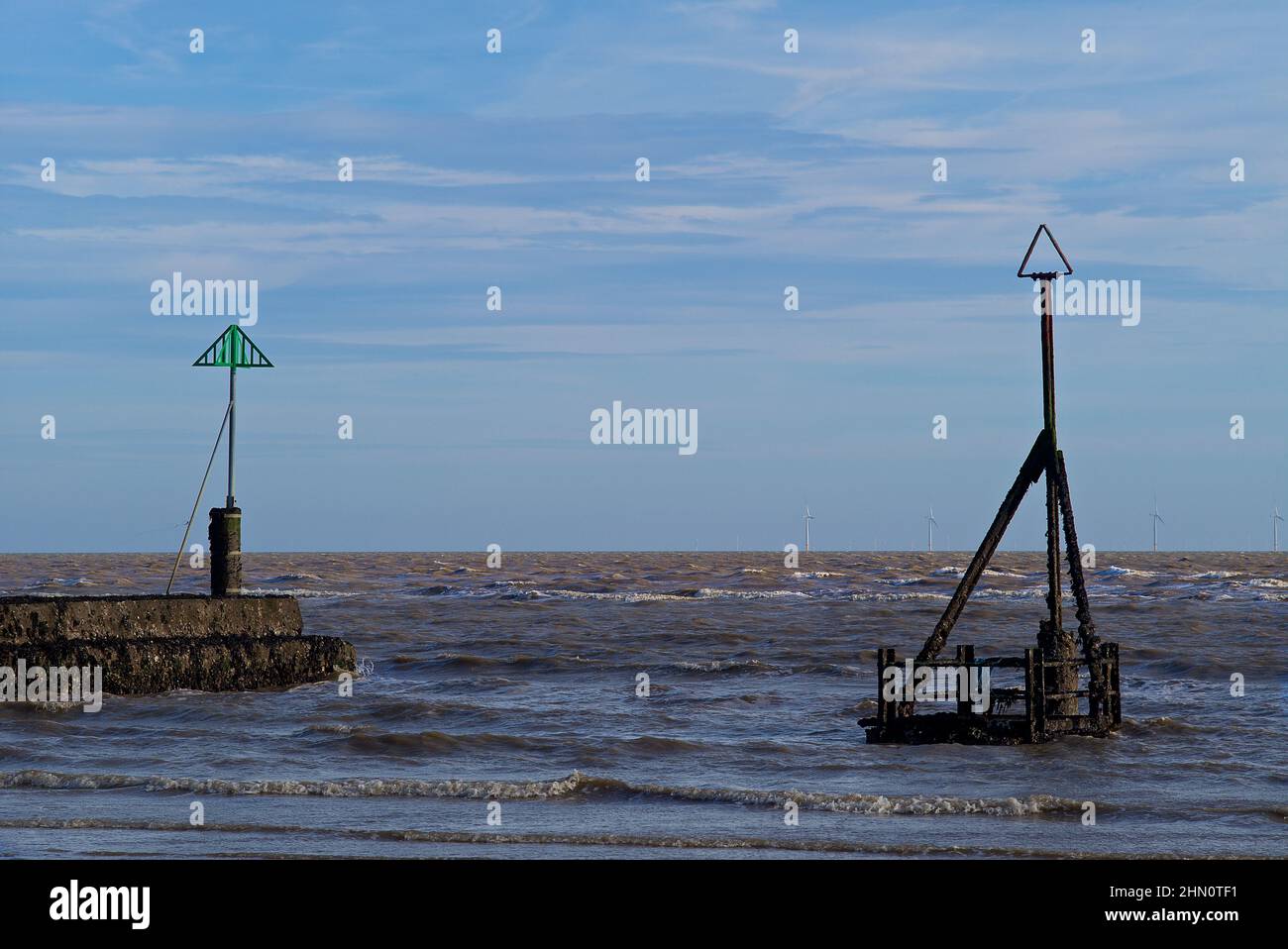 Old Victorian groyne marker and a modern groyne marker marking the end ...