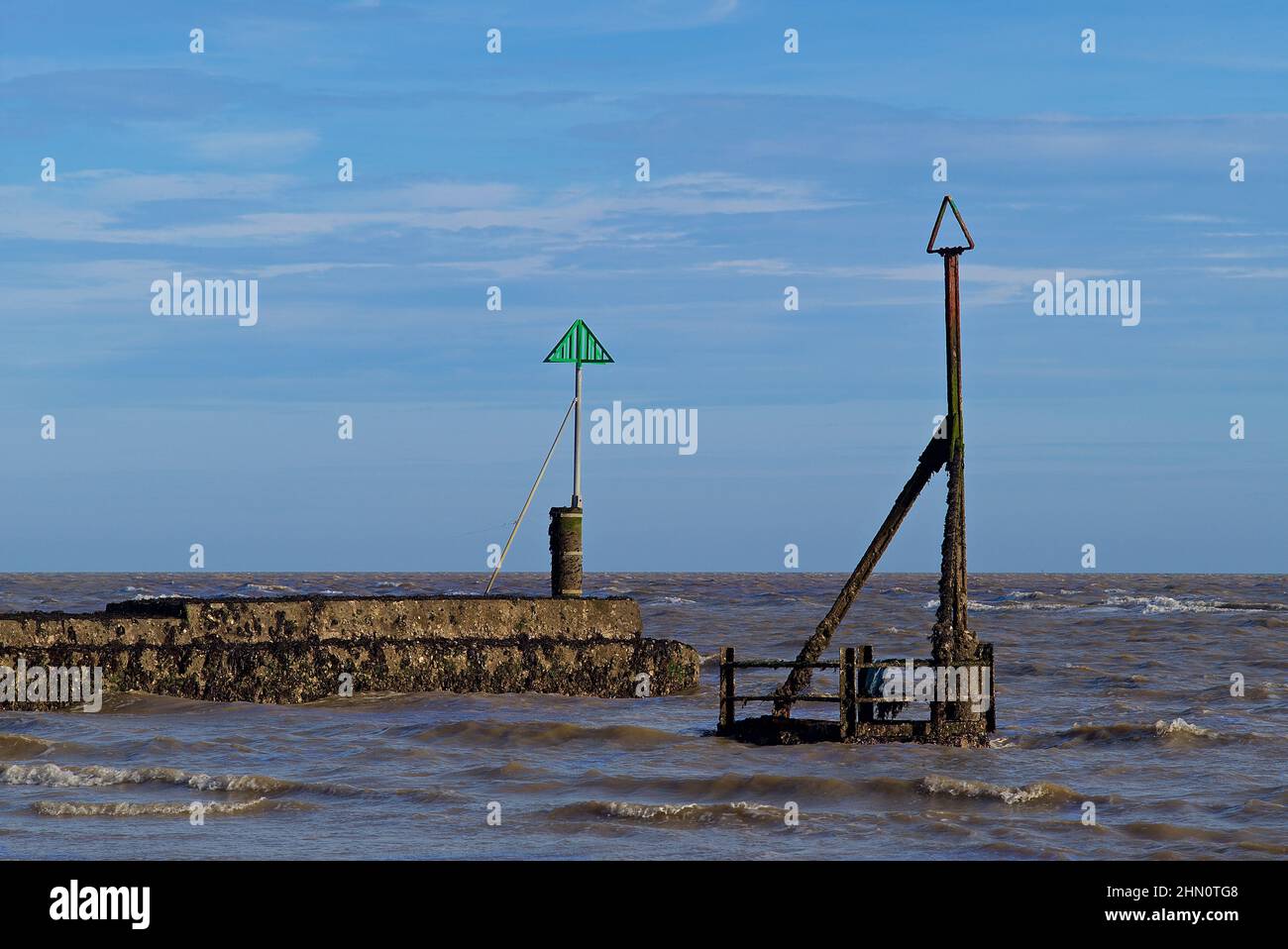 Old Victorian groyne marker and a modern groyne marker marking the end ...