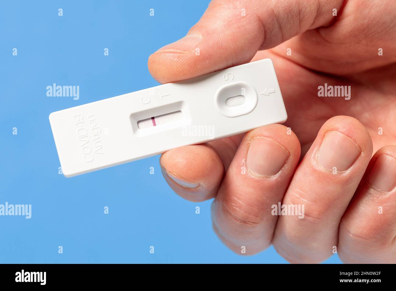 Hand showing Covid-19 negative test result with SARS CoV-2 Rapid ...
