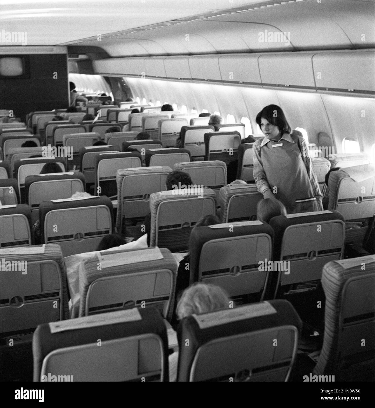 The passenger cabin of the aircraft during the flight. USA, 1977 Stock ...