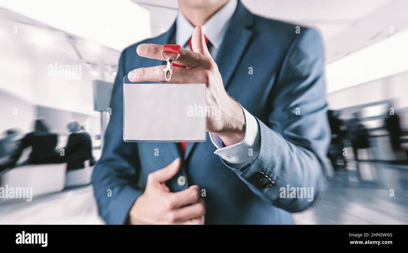 Businessman showing a blank identity name card at a exhibition Stock Photo - Alamy