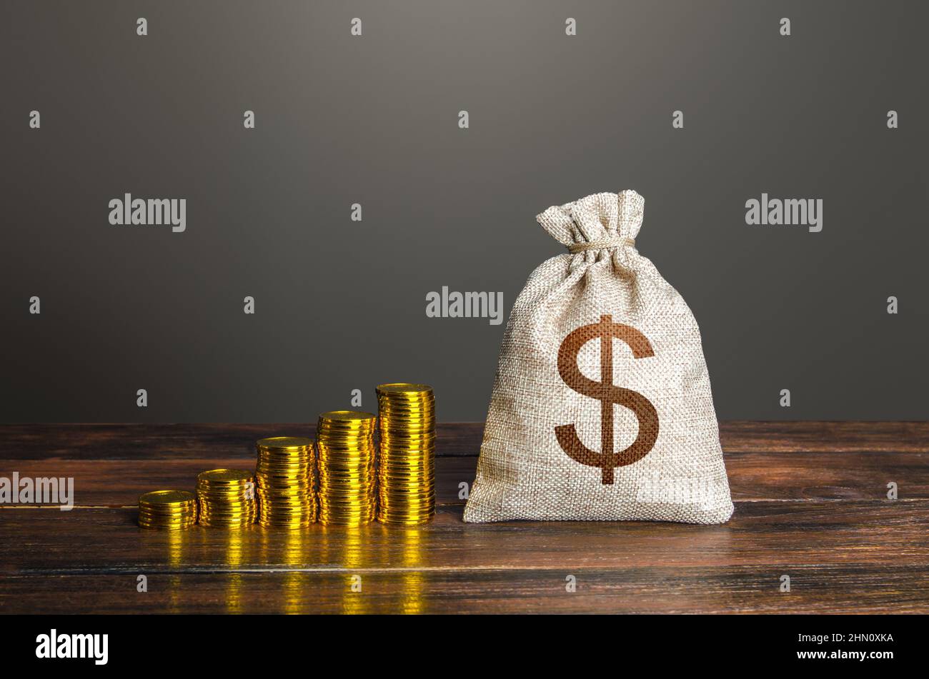 Dollar money bag and increasing stacks of coins. Savings and ...