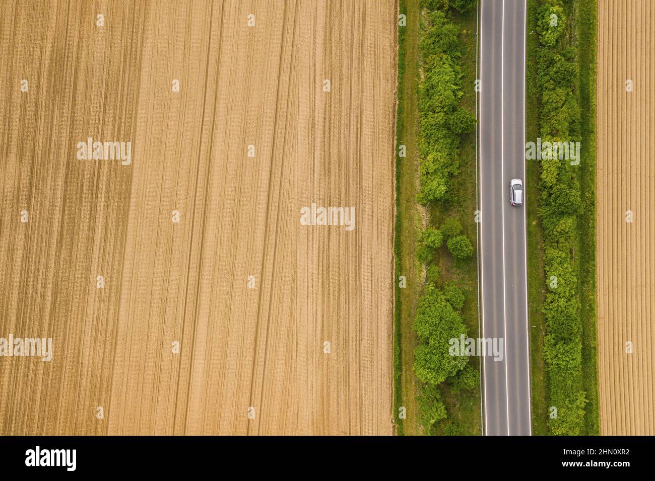 Aerial view of car moving on the road. Road traffic concept background ...