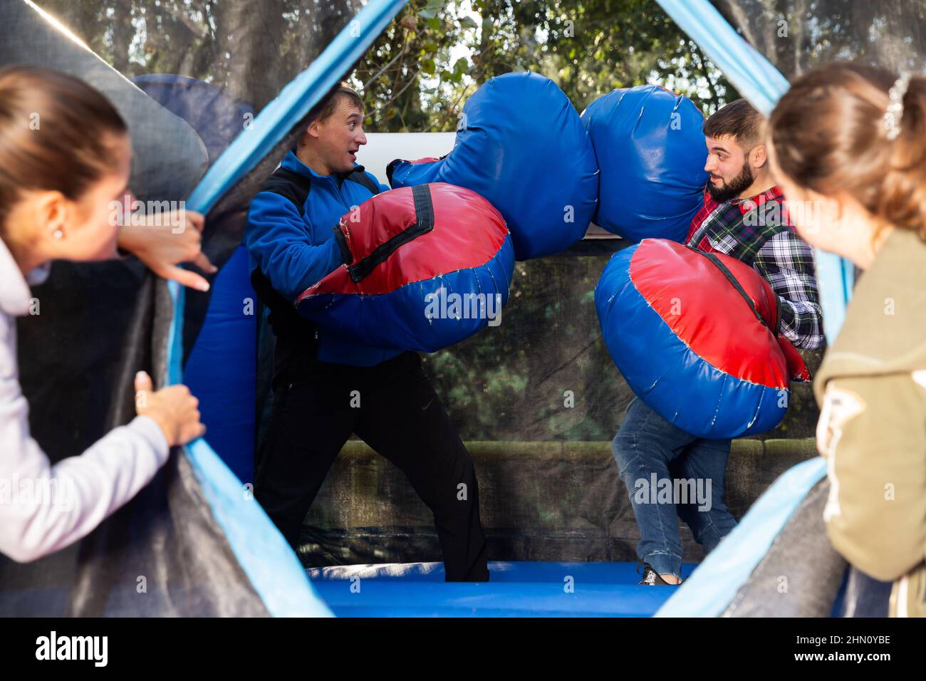 Men boxing on inflatable ring Stock Photo - Alamy