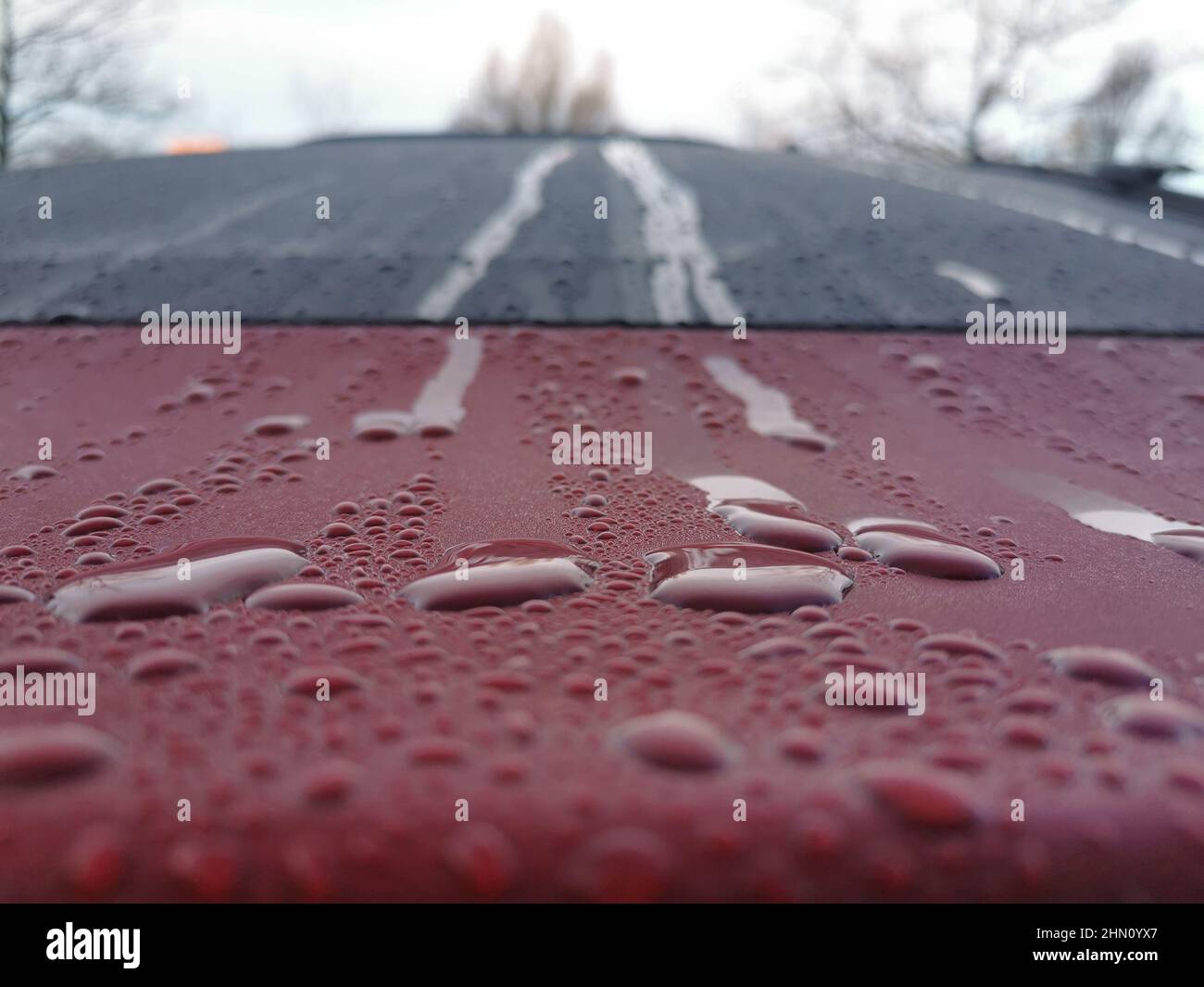 Raindrops on car roof hi-res stock photography and images - Alamy