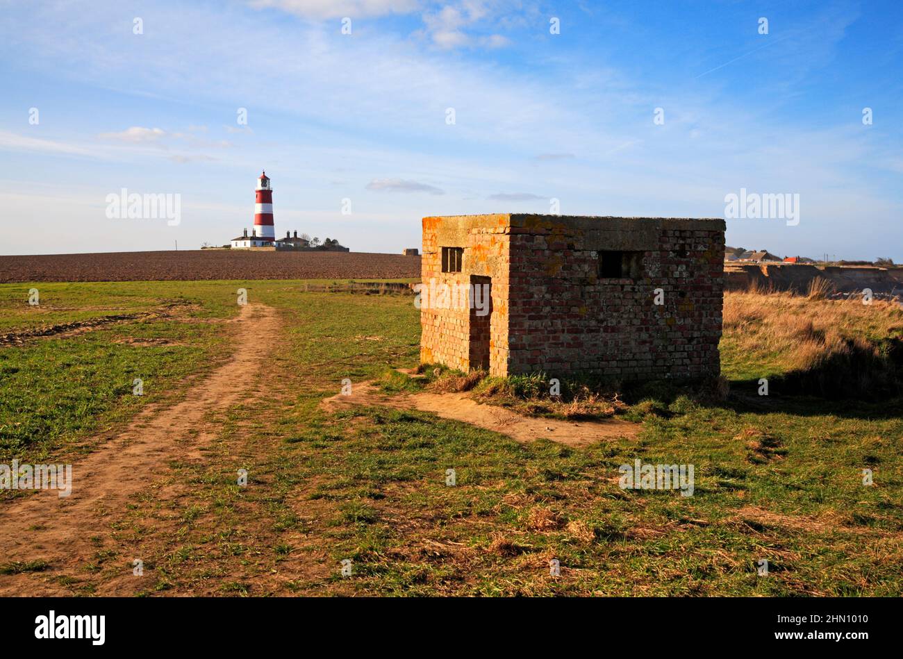 A World War Two Type 26 square Pill Box with 18th century Lighthouse in ...