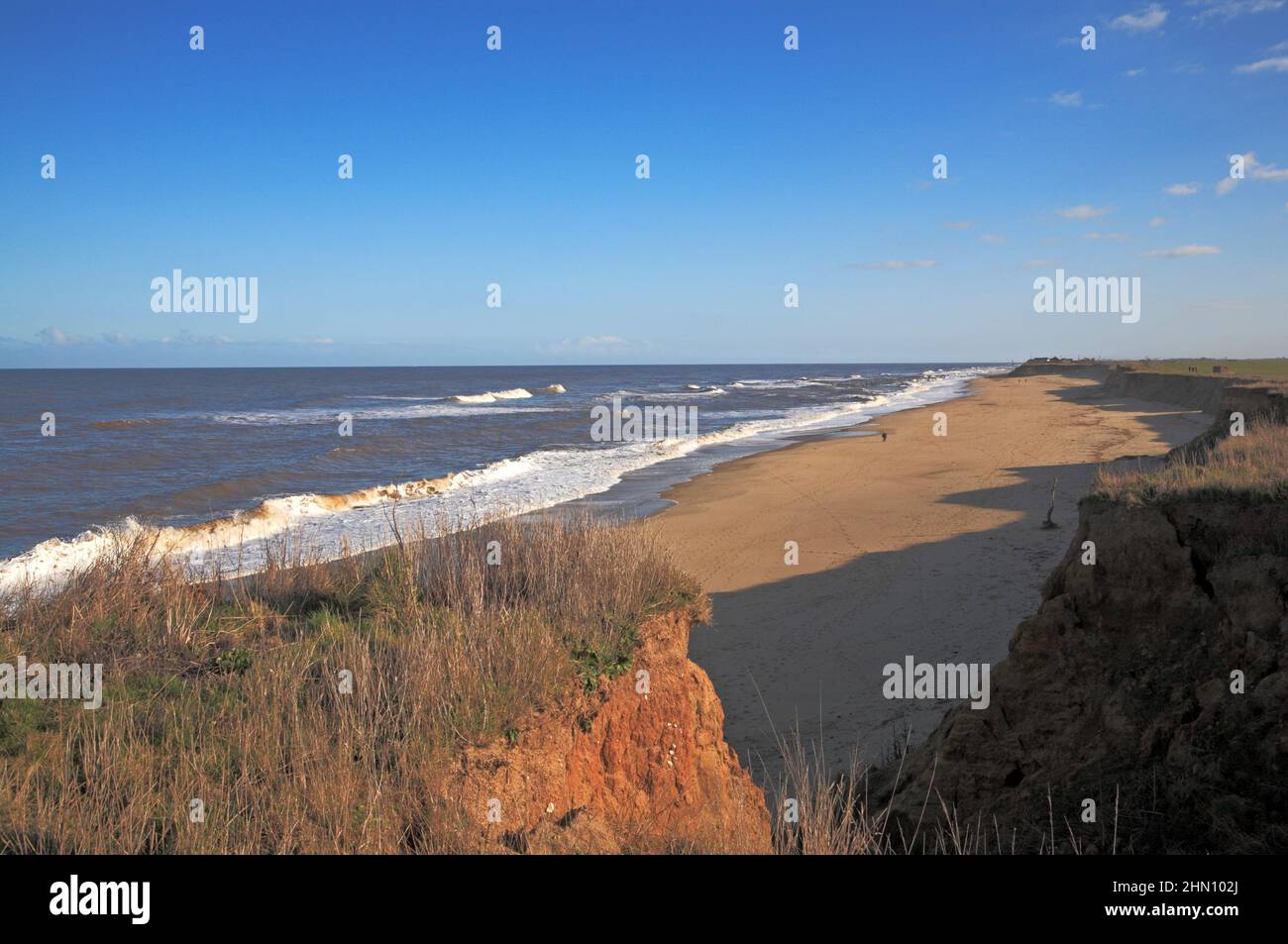 A view of the beach and eroding cliff line on the North Norfolk coast ...