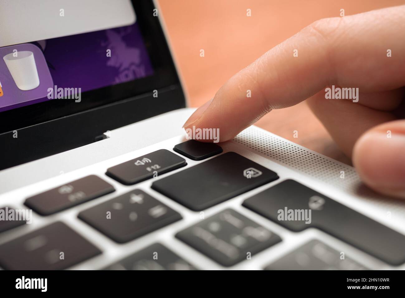 Kharkov, Ukraine - February 9, 2022: Hand pressing fingerprint scanner ...