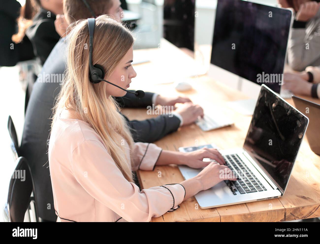 Male colleagues using computers work hi-res stock photography and ...