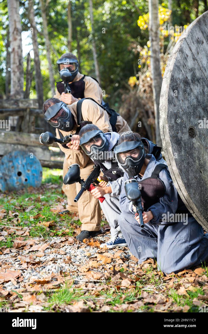 Paintball players aiming outdoors Stock Photo - Alamy