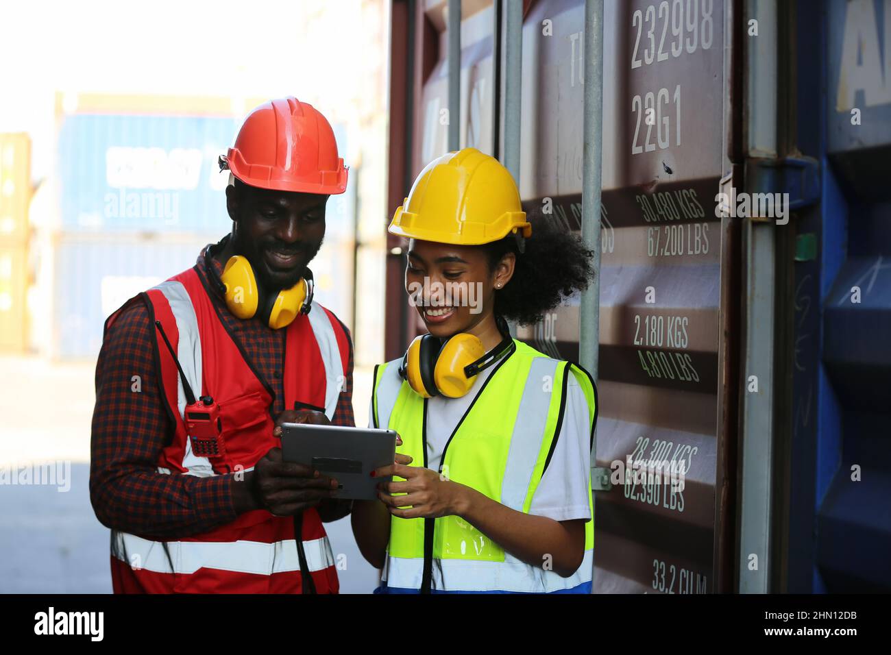 Foreman control loading Containers box from Cargo freight ship for ...