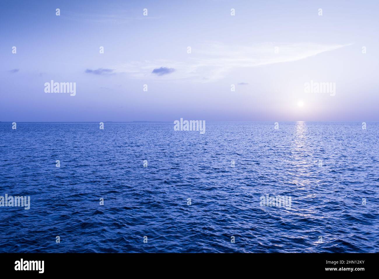 Watercolor blue sunset over the blue ocean Stock Photo - Alamy