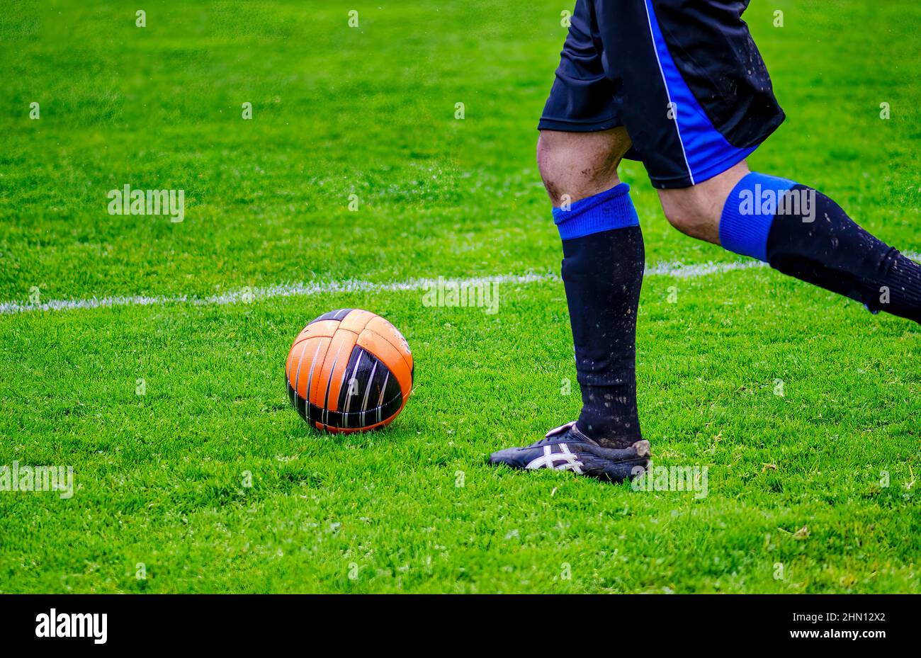 Professional footballer kicking stadium hi-res stock photography and ...