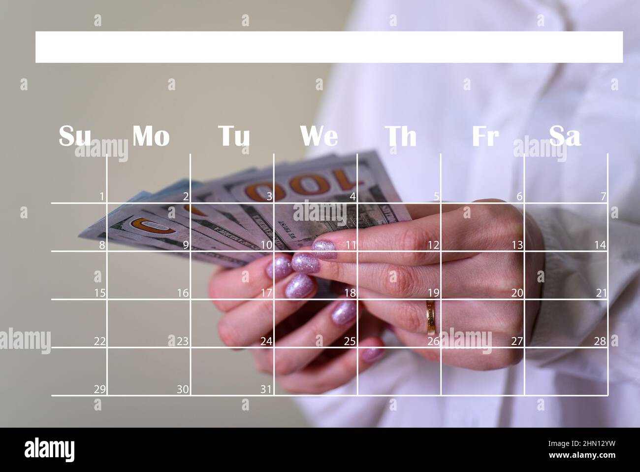 Money in the hands of a woman and a calendar. The concept of paying a ...