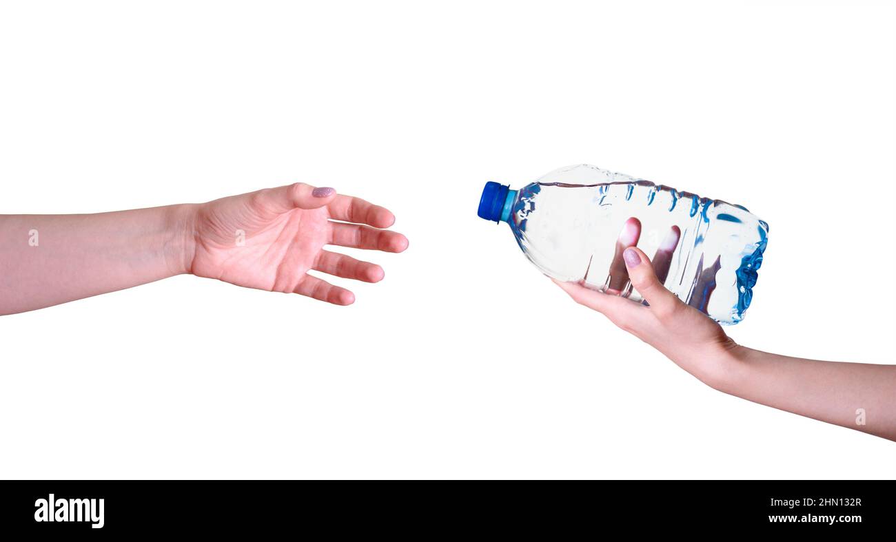 A woman's hand with a bottle of water passes to the other hand on a ...